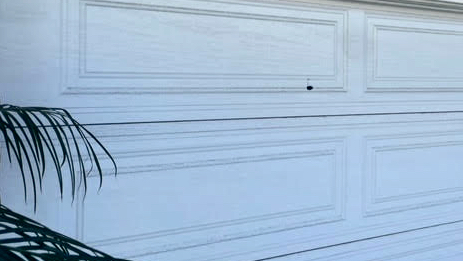 CUMBRE DRIVE – Bullet hole entry – exterior of garage door. – South ...